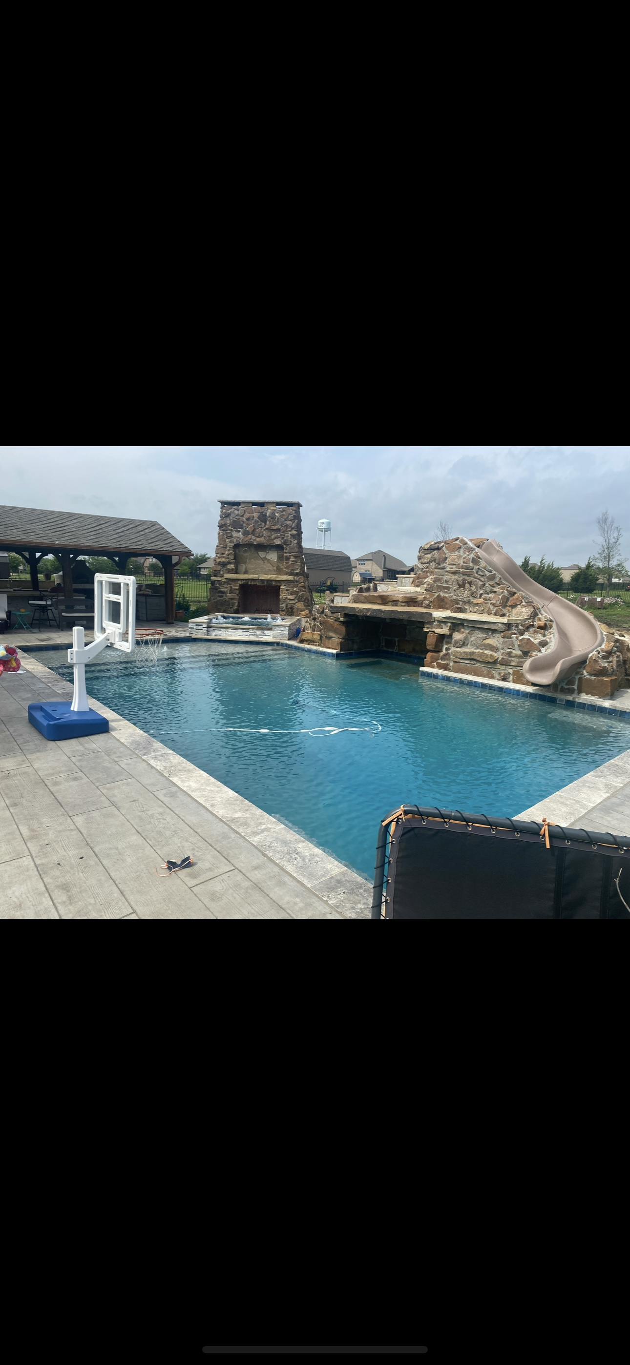 Amazing pool with slide and jump ledge outdoor kitchen and private ...
